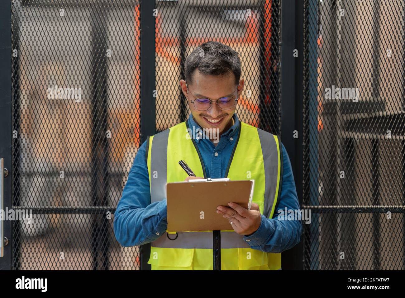 Working at warehouse. Male warehouse worker checking in storage ...
