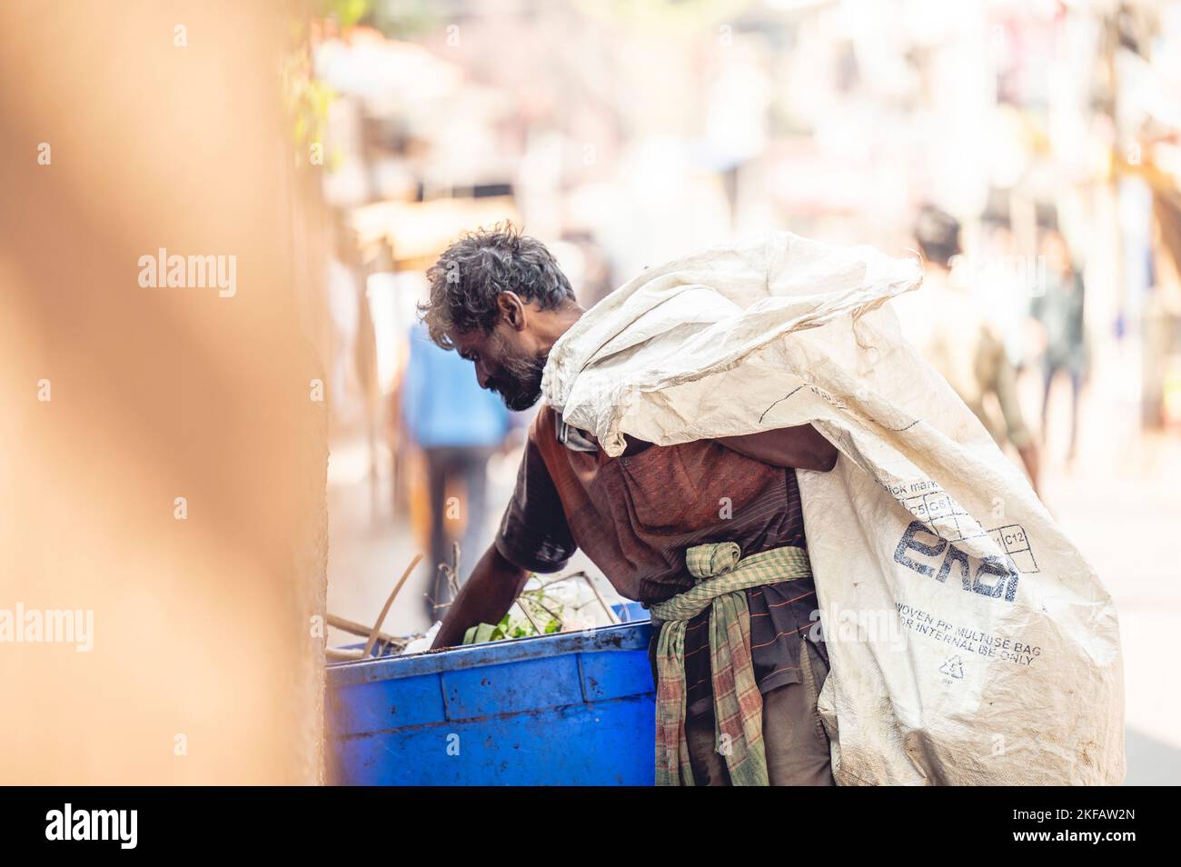 Homeless man looking garbage dumpster hi-res stock photography and ...