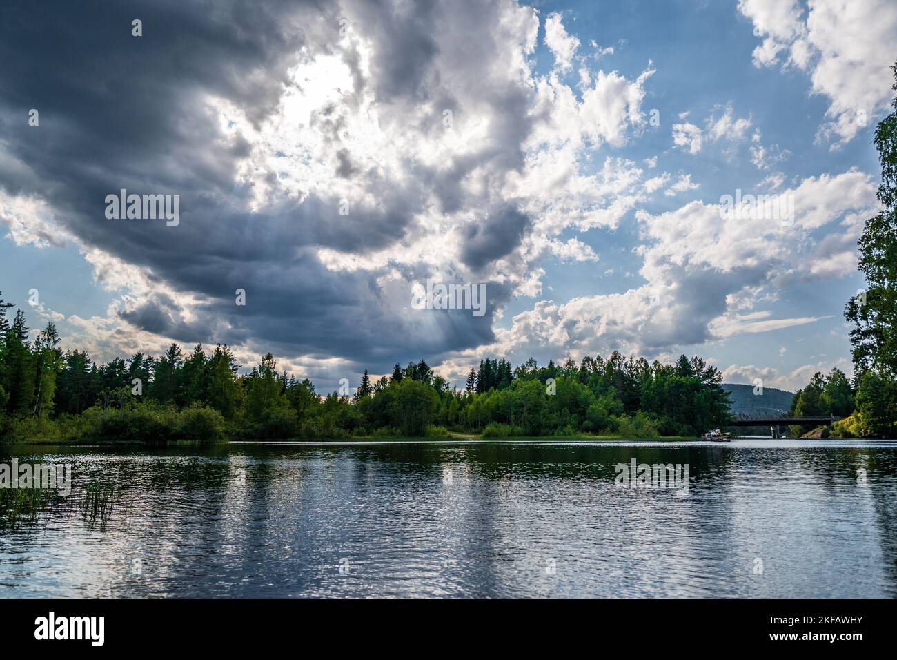 A lake under a cloudy sky Stock Photo - Alamy