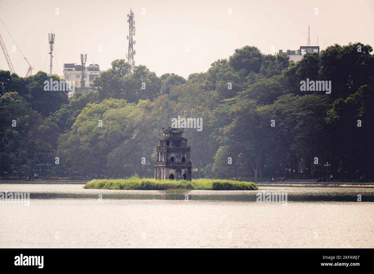 A scenic view of the temple located on a small island in the lake of ...