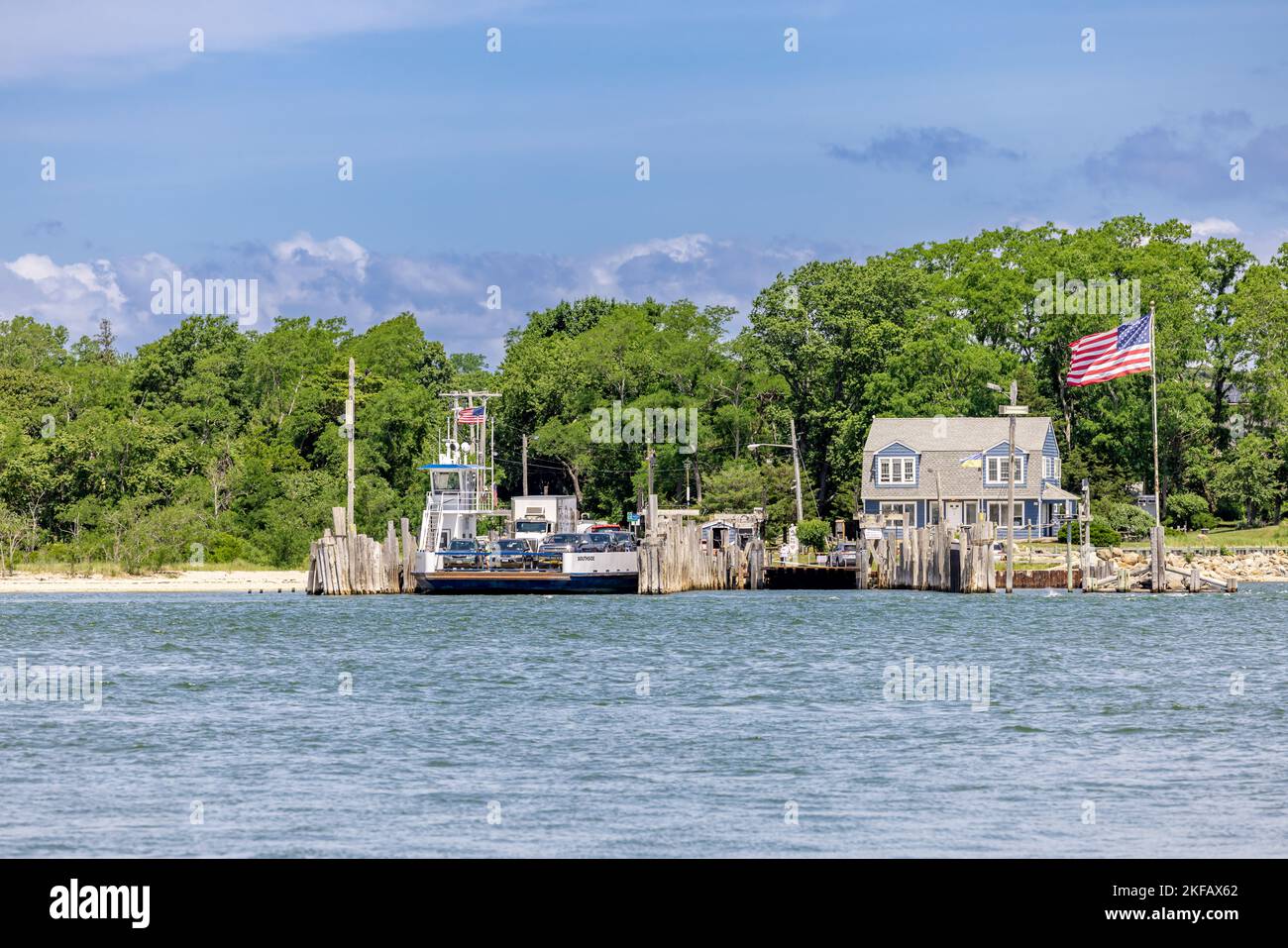 Shelter Island ferry loaded with vehicles in dock in Shelter Island, NY ...