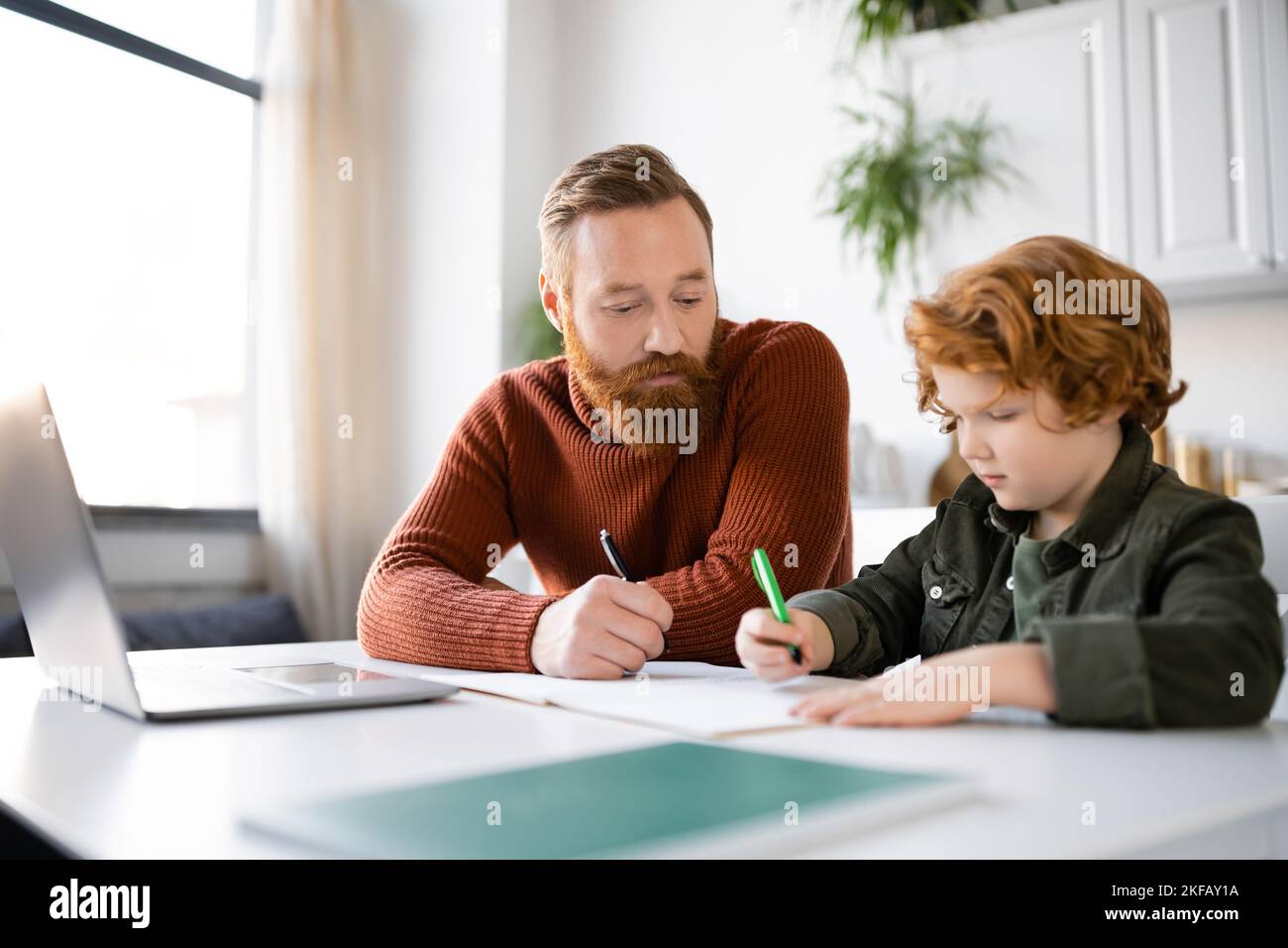 Child write laptop hi-res stock photography and images - Alamy
