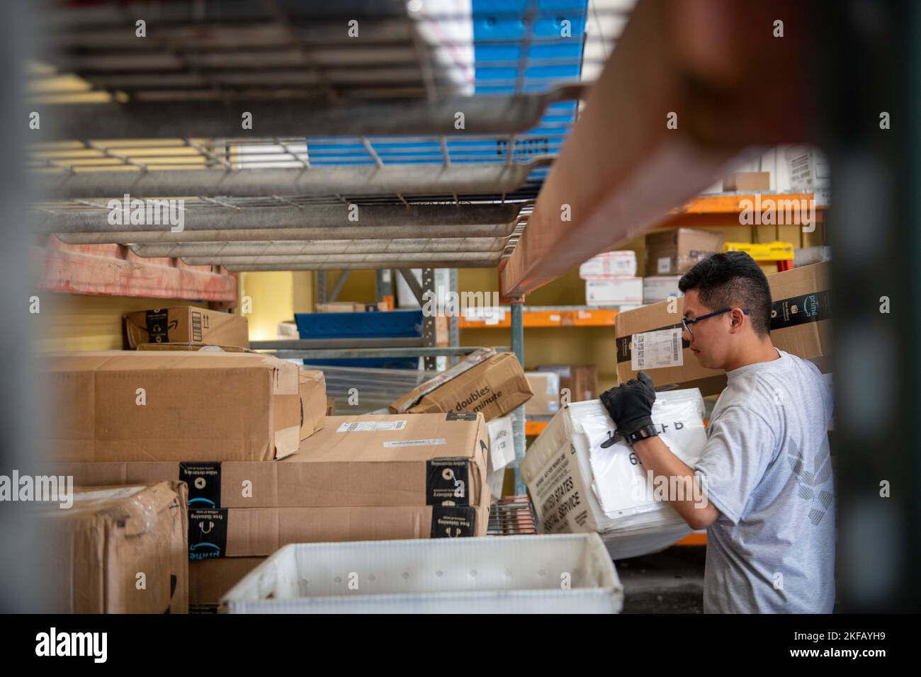 U.S. Air Force Senior Airman Bobby Lo, a military postal clerk with the ...