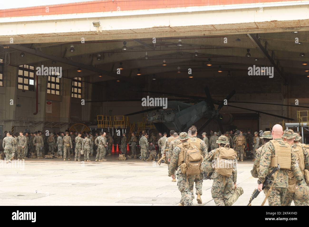 U.S. Marines with 3d Marine Division assemble at a hangar during an ...