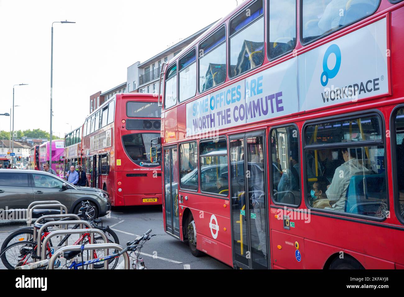 Double-decker busses are seen outside Barking Station in East London in ...