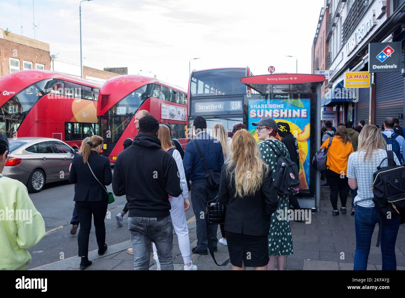 People wait for busses outside Barking Station in East London in the ...