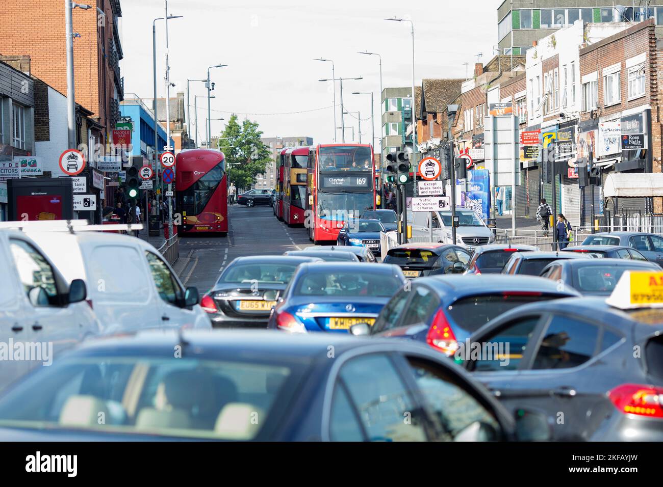 Double-decker buses are seen in and around a congested roundabout in ...