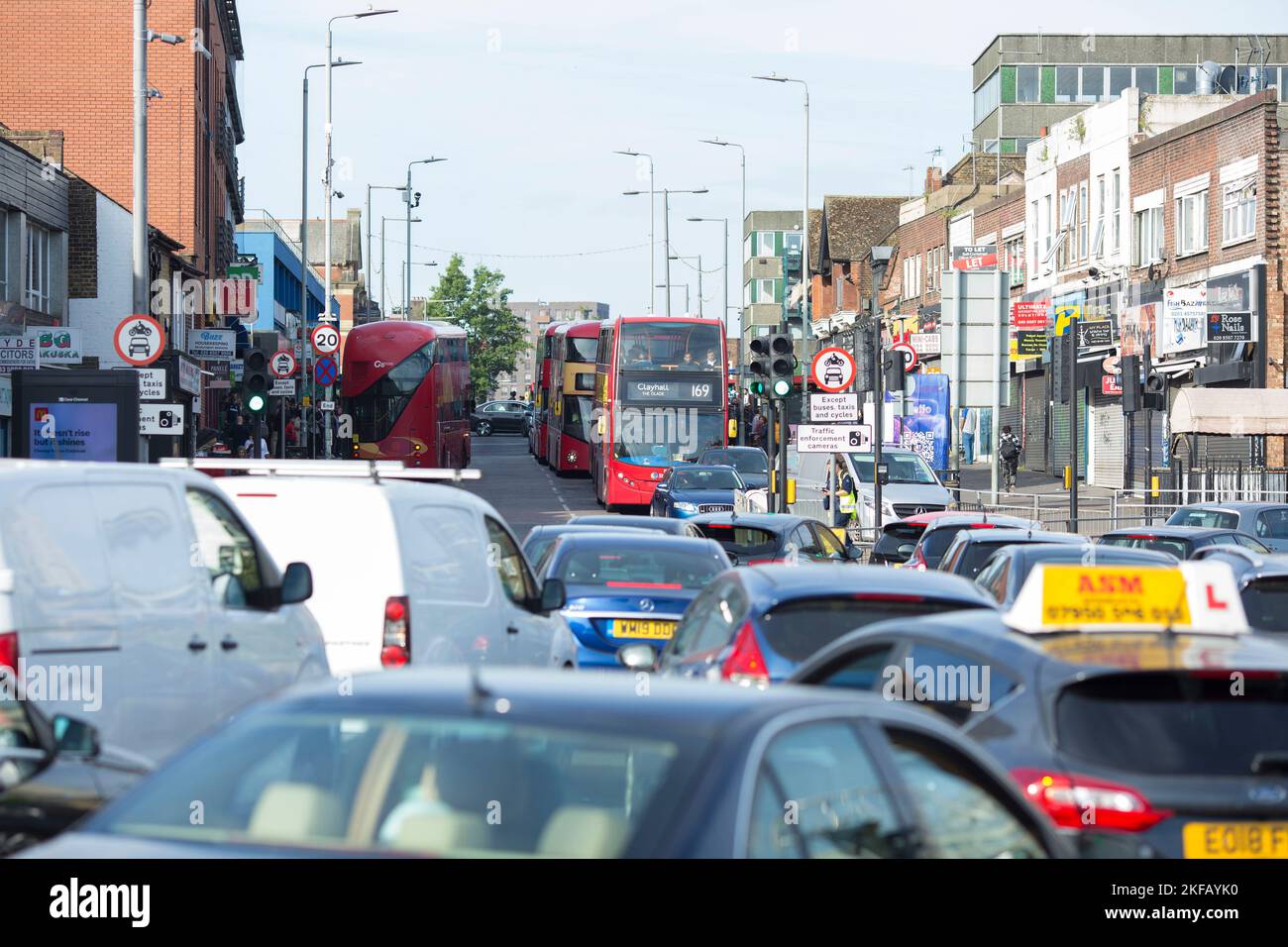 Double-decker buses are seen in and around a congested roundabout in ...