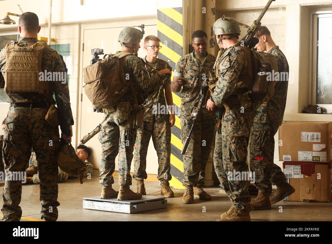 U.S. Marines with 3d Marine Division are weighed in preparation for ...