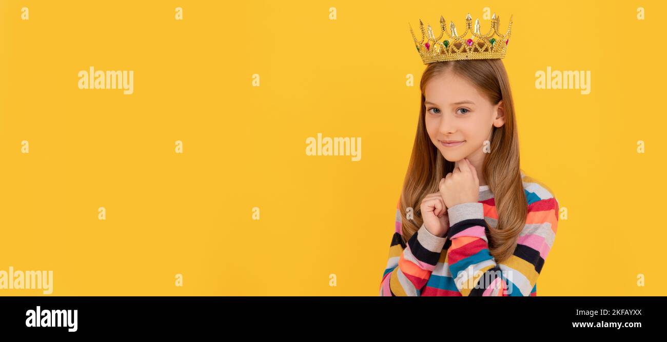 smiling teen child in queen crown on yellow background. Child queen ...