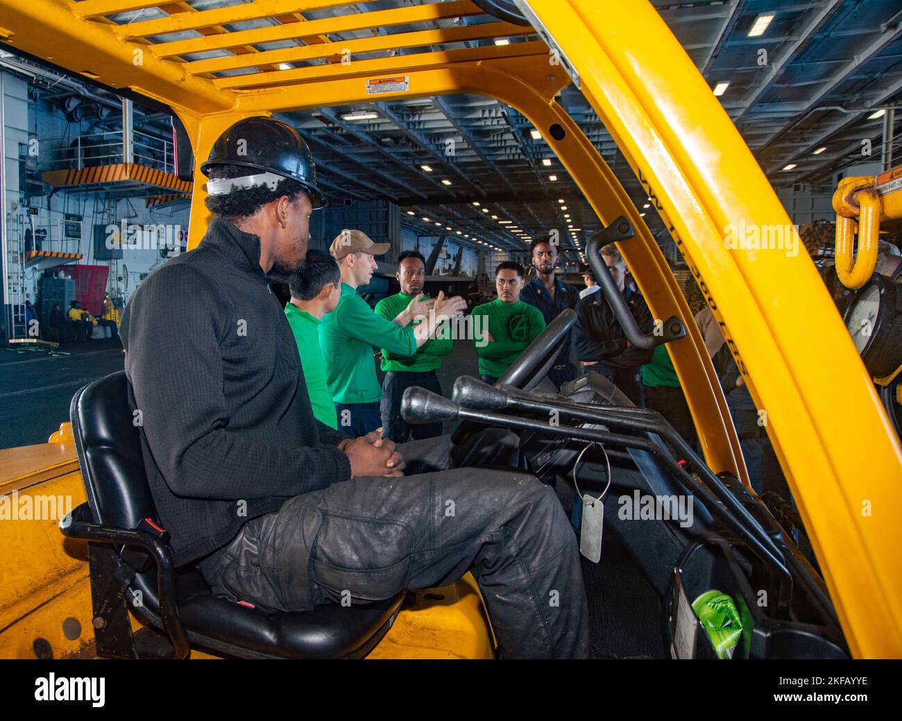 220901-N-TO573-1087 ATLANTIC OCEAN (Sep. 1, 2022) Sailors receive ...