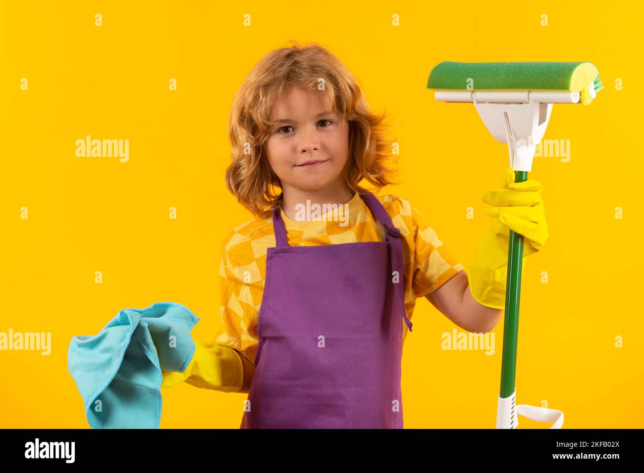 Little kid cleaning at home. Child doing housework having fun. Studio ...
