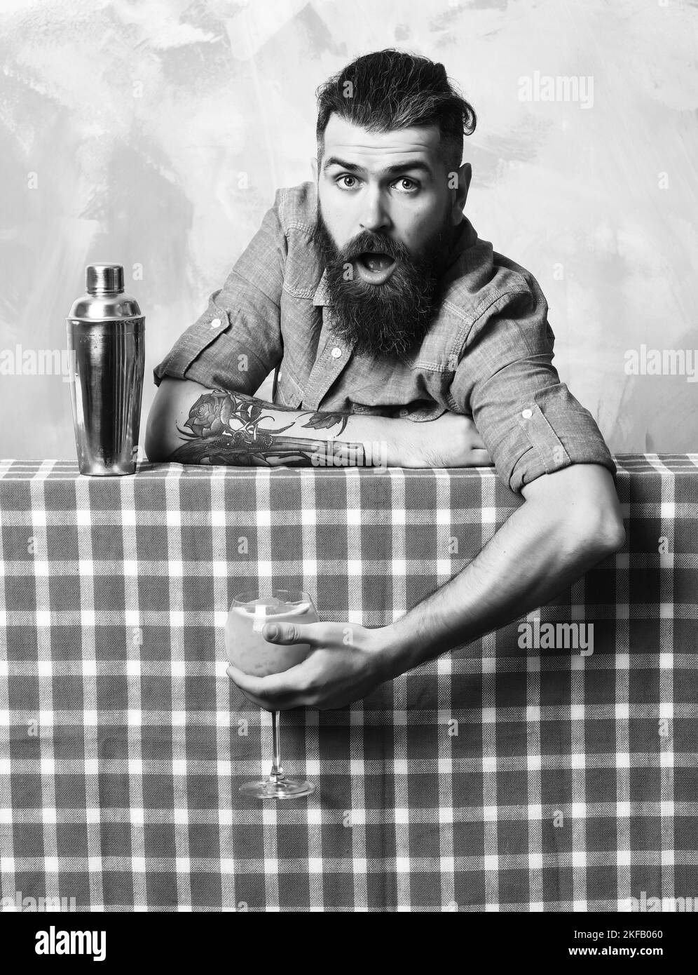 Brutal caucasian hipster holding tropical alcohol fresh cocktail Stock ...