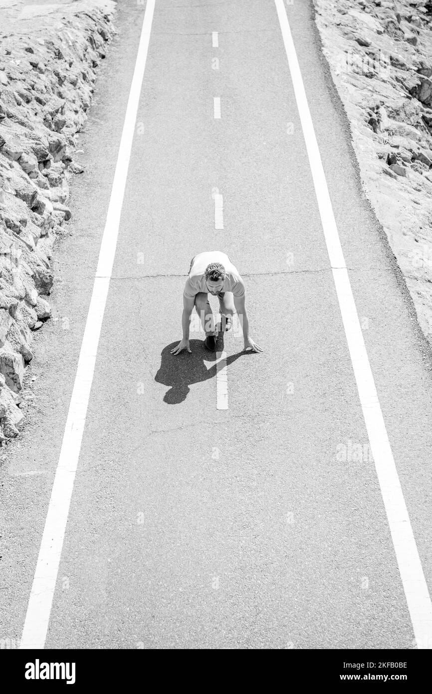 healthy lifestyle. mature man on road start. sport activity. full of ...