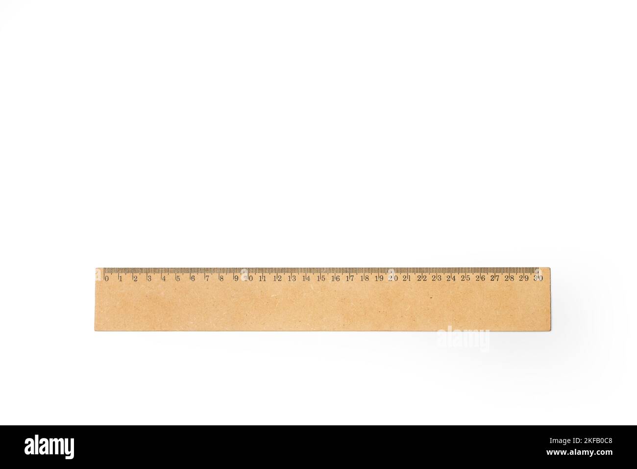 Wooden ruler on a white background with copy space Stock Photo - Alamy