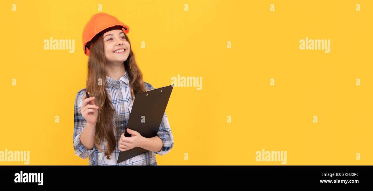 Builder teenager girl in helmet. happy teen girl in helmet and ...