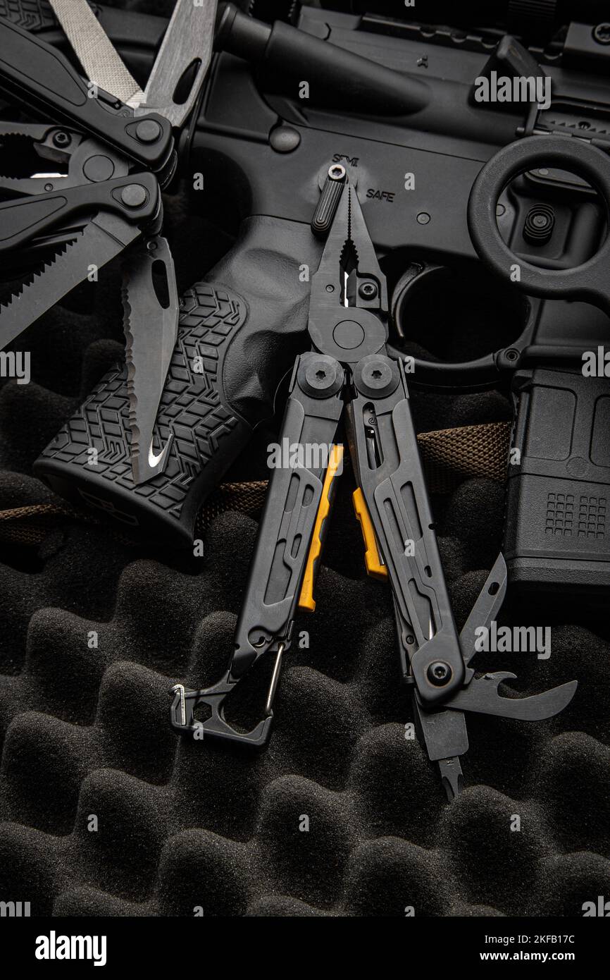 Modern multitool with many tools. A portable multi-tasking military ...