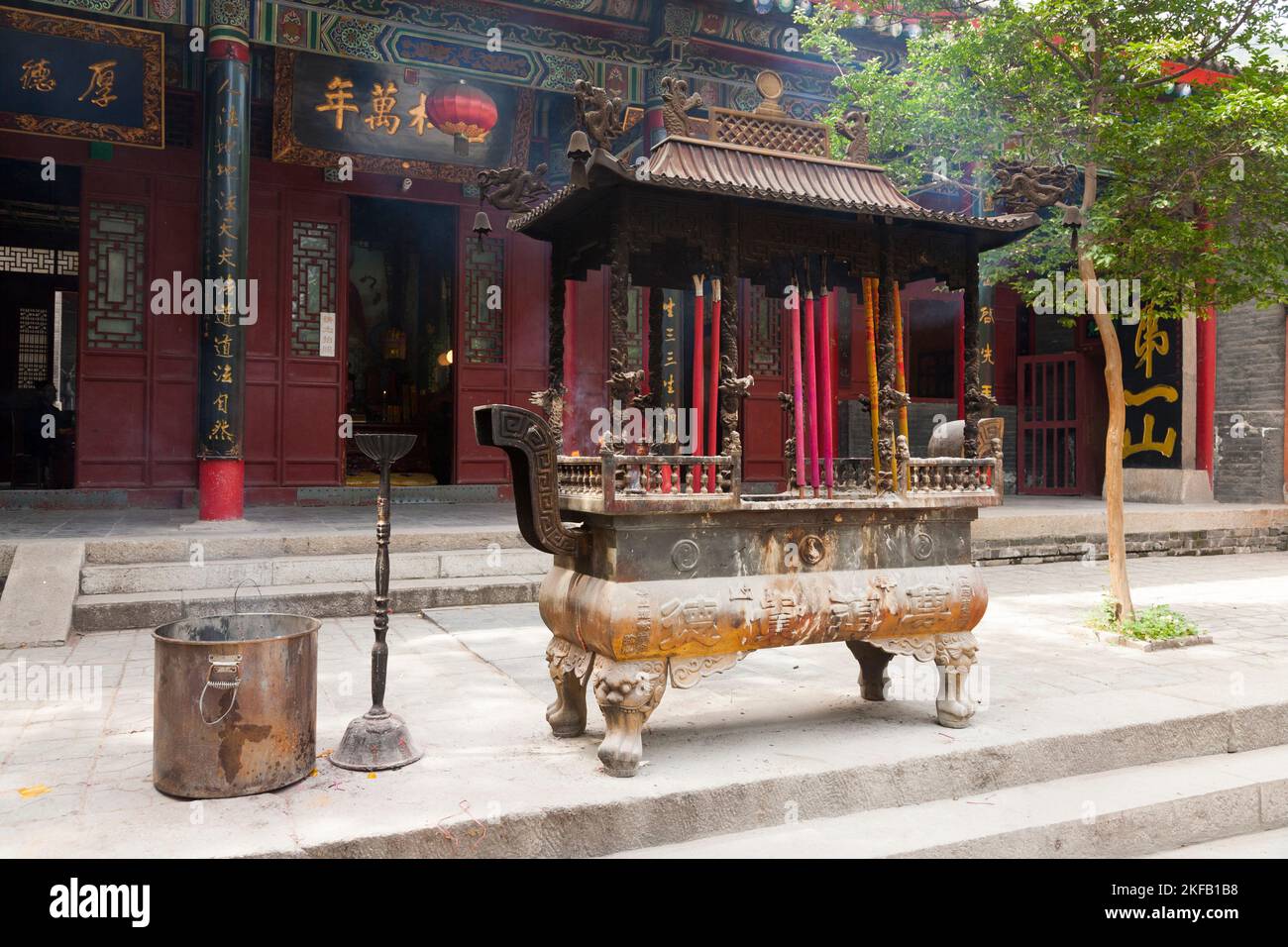 Incense sticks burn in a cast metal burner in the Taoist Jade Spring ...