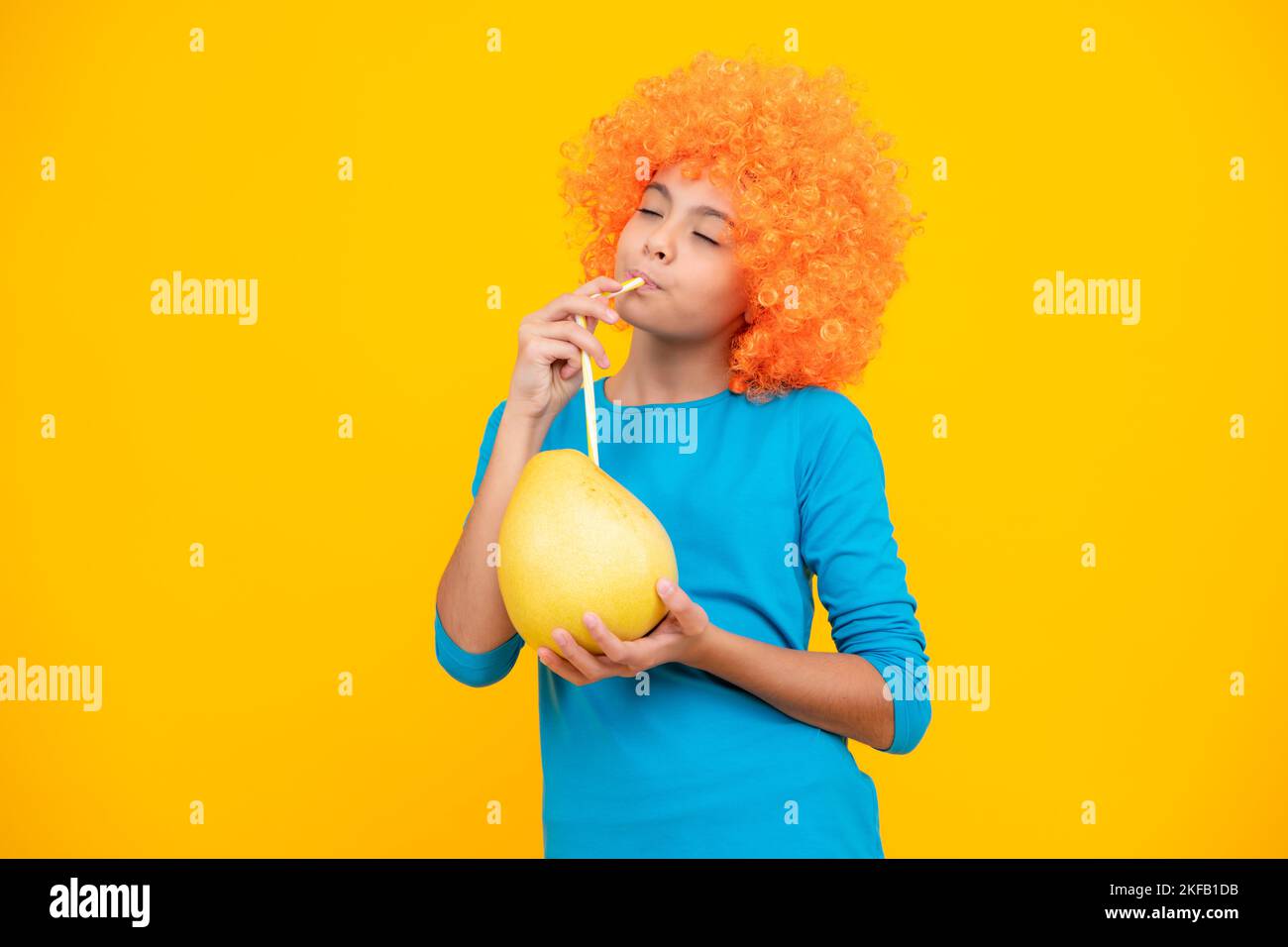 Teenager child girl hold citrus fruit pummelo or pomelo full of vitamin ...