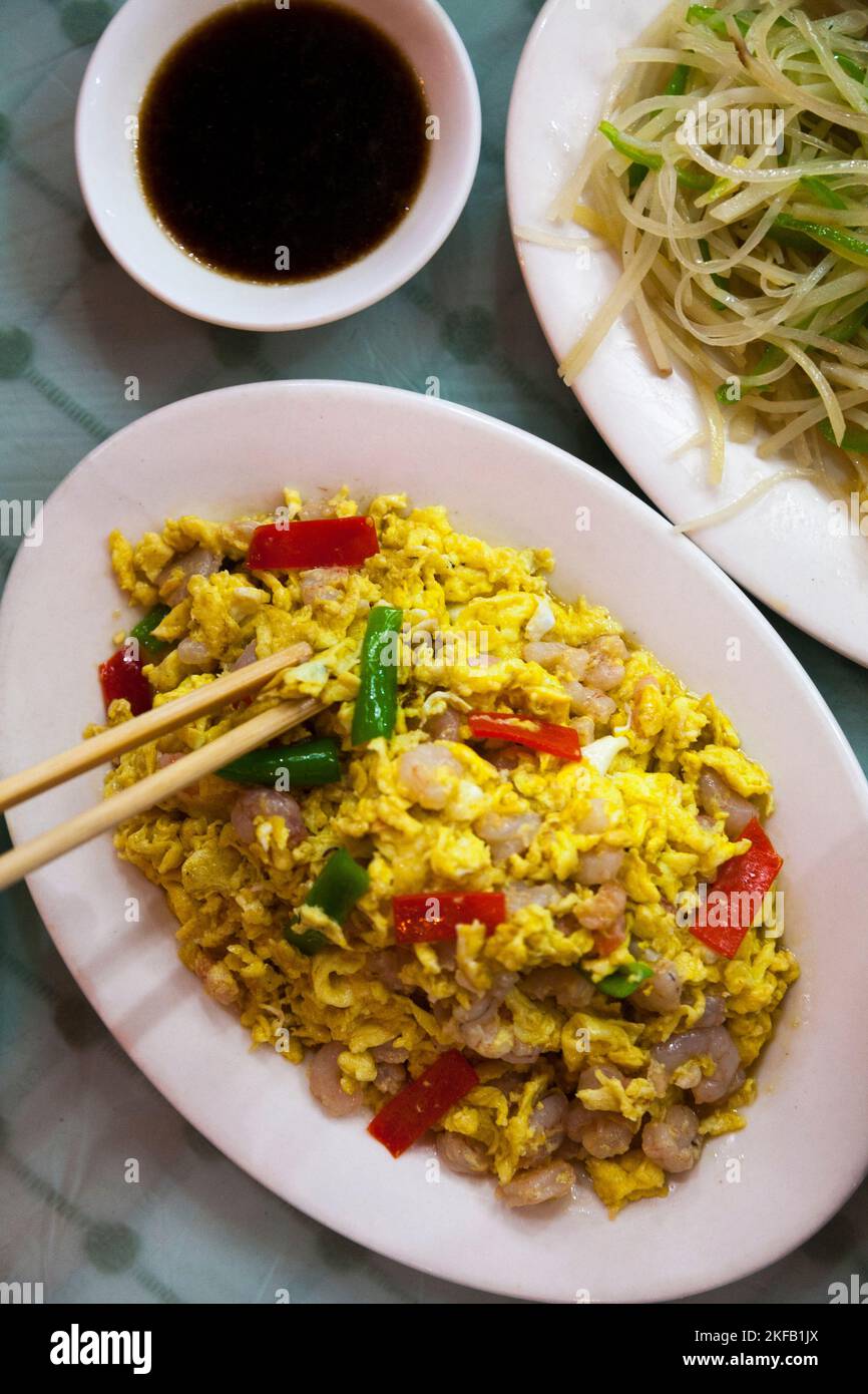 Bowls of Chinese food / plate of prepared omelette with shrimp / prawn ...