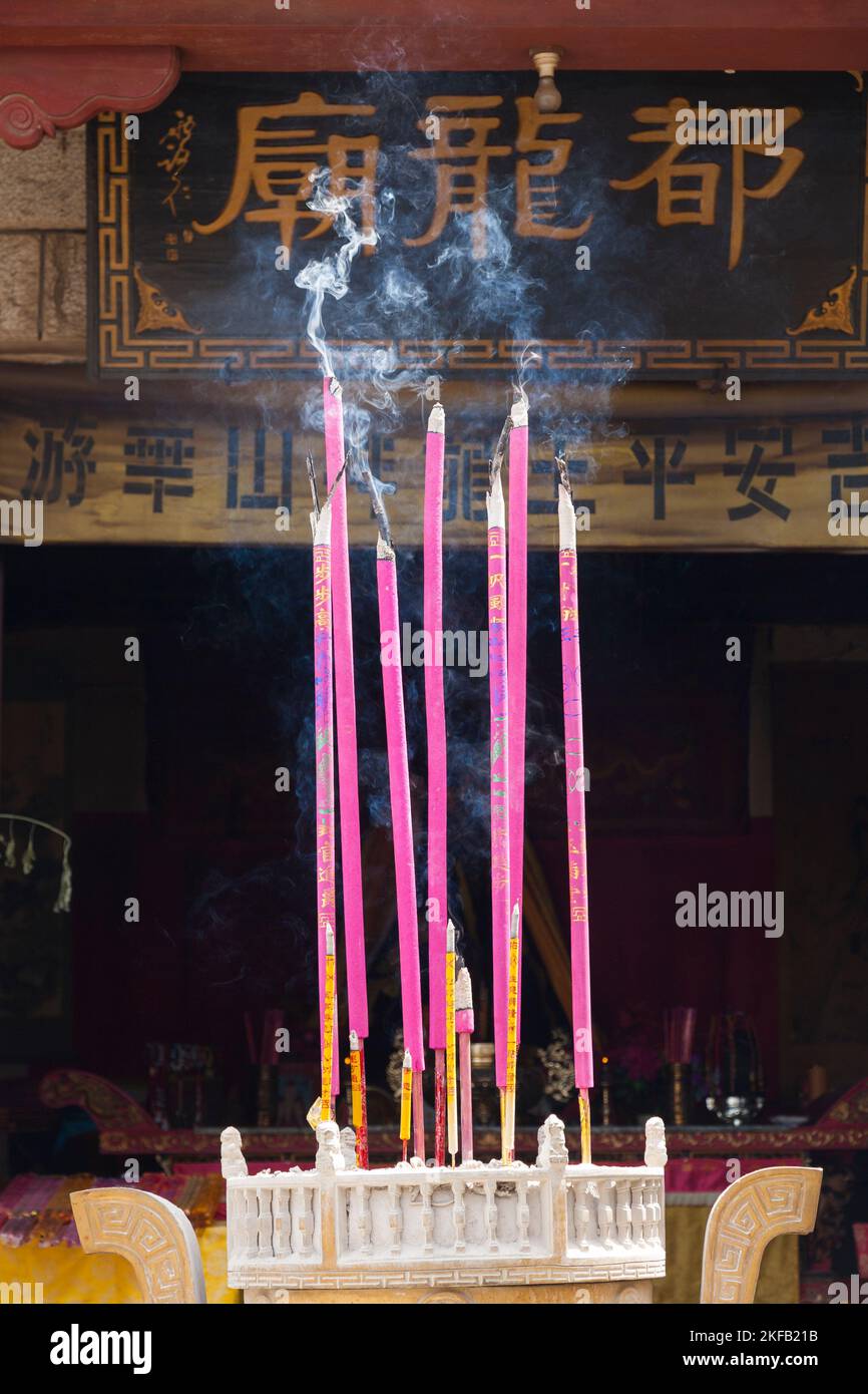 Altar shrine with Taoist imagery in a temple building encountered when ...