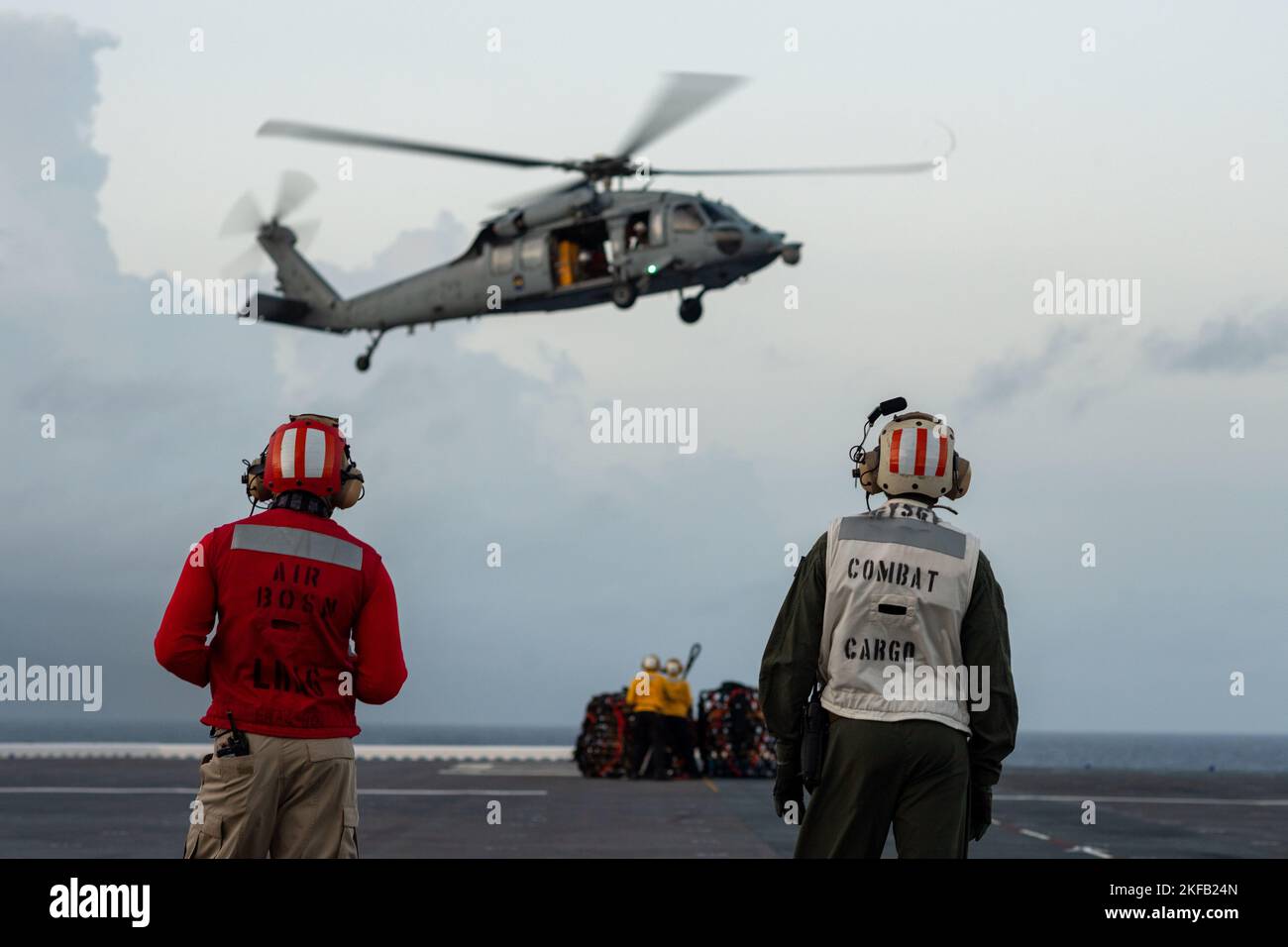 EAST CHINA SEA (Sept. 1, 2022) Ensign Keji Akinadarijo, left, from ...