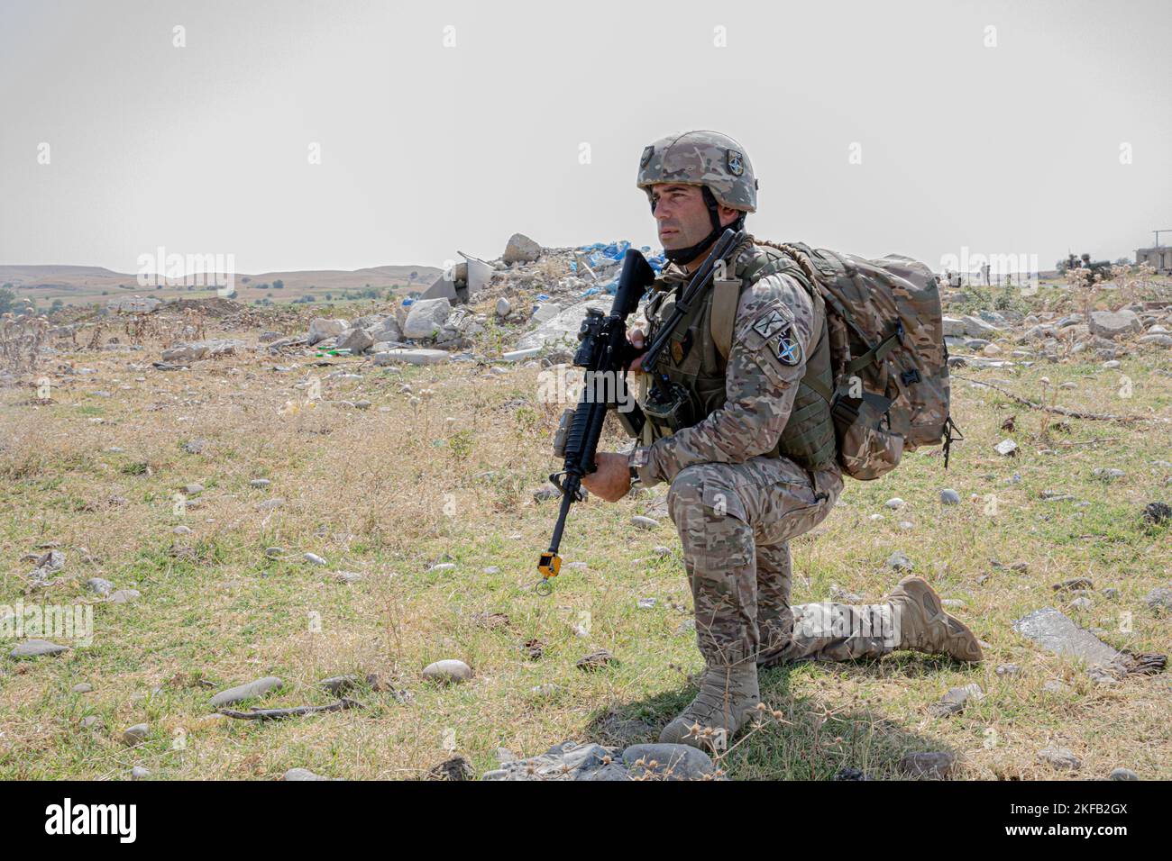 Georgian Defense Forces scan their sectors of fire for a defensive ...