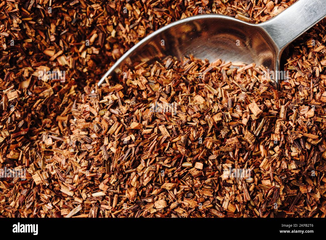 Dry leaves of red rooibos tea, texture background closeup Stock Photo ...
