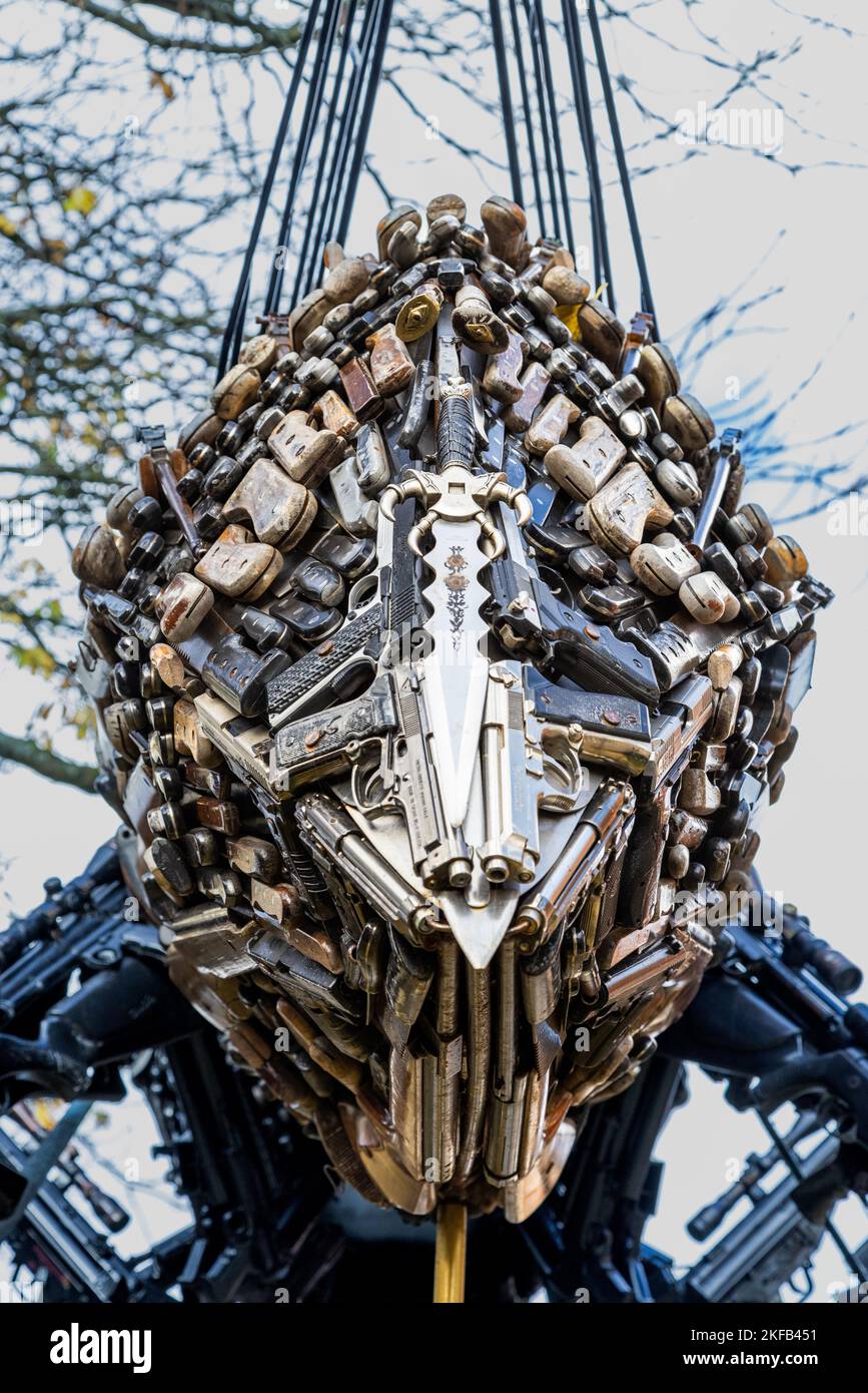 Rear section of a giant bee, made from knives and guns seized or handed ...