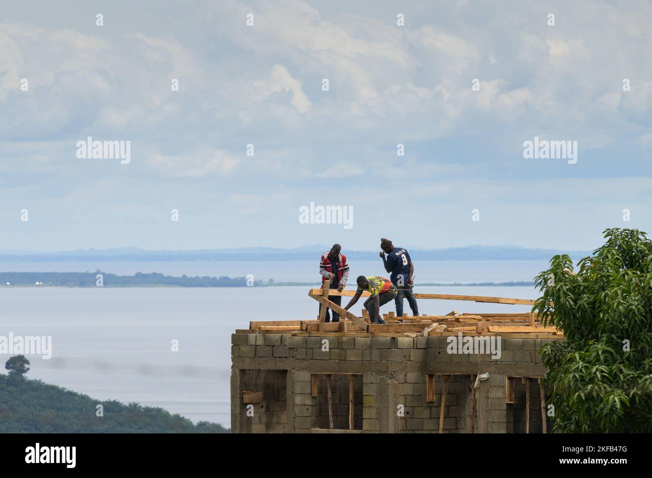 Bugala Island, Uganda - May 30, 2022: Construction workers building a ...