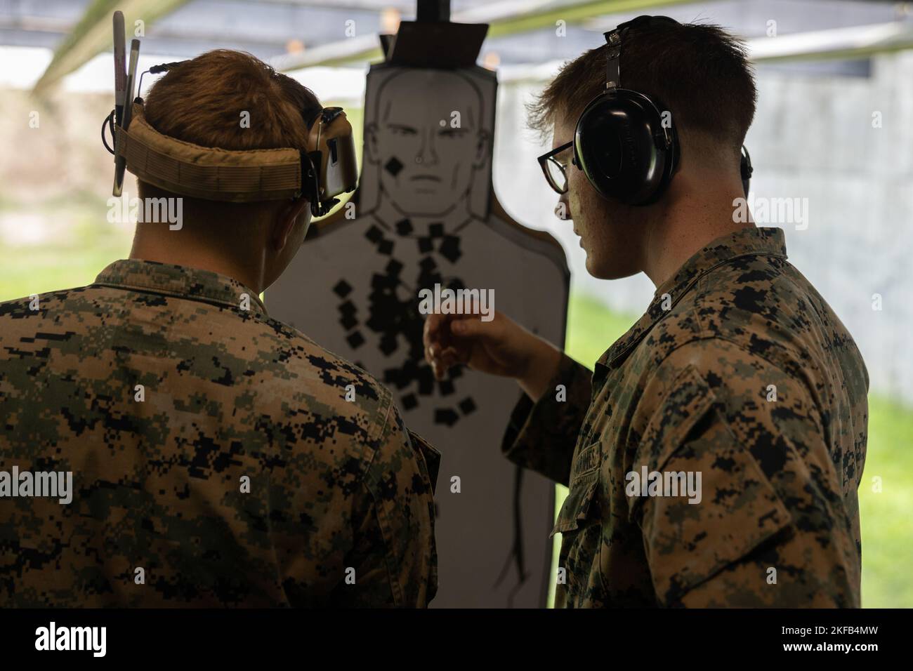 U.S. Marine Corps Lance Cpl. Frank Pandolfi, left, range coach, Marine ...