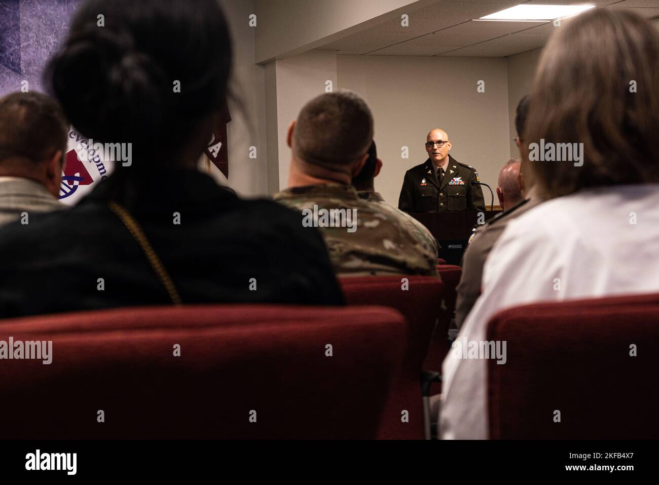 Newly promoted Lt. Col. Daniel Rhoades speaks to friends, family and ...