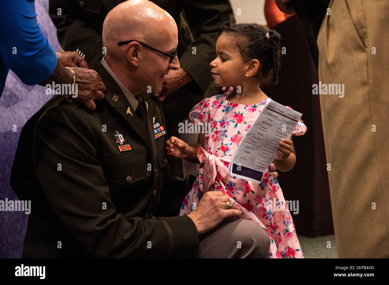 Newly promoted Lt. Col. Daniel Rhoades spends a moment with his ...