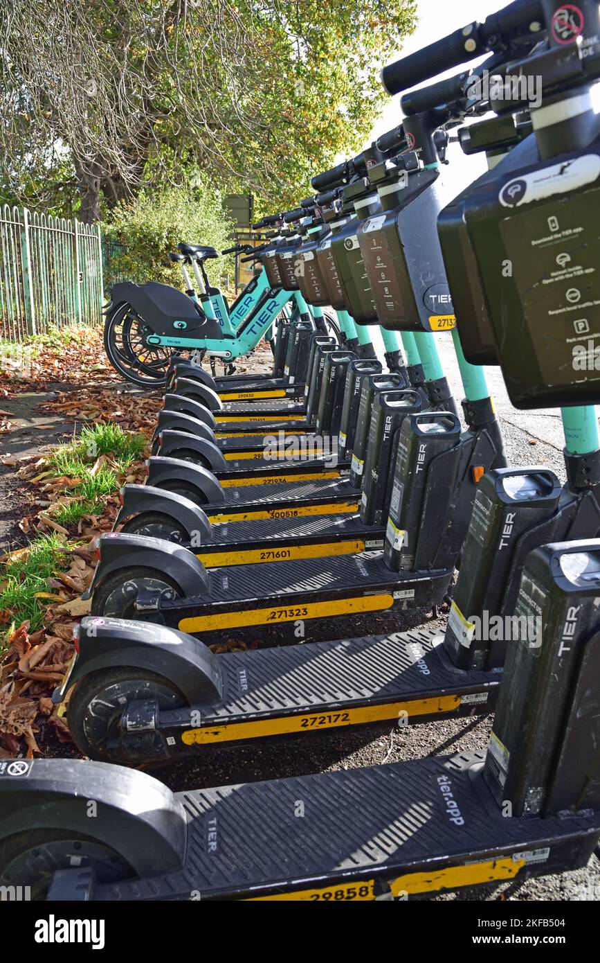 Rear view of Tier Electric Scooters at parking station availabe for ...