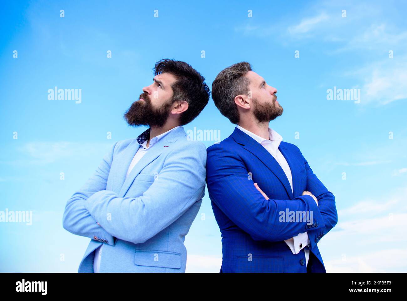 Business men stand blue sky background. Perfect in every detail. Well ...