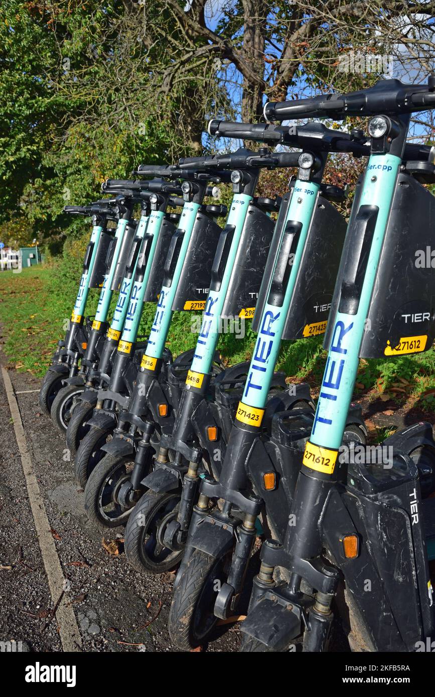 Side view of Tier Electric Scooters at parking station availabe for ...