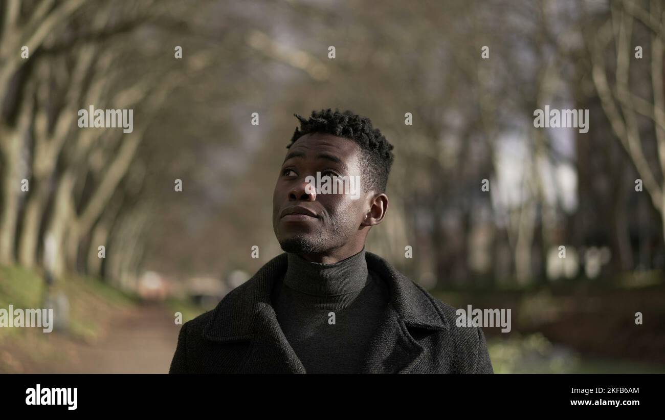 Contemplative black african male walking hi-res stock photography and ...