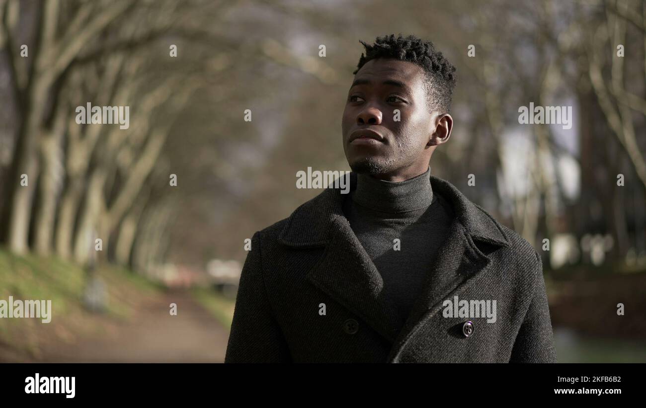 Contemplative black african male walking hi-res stock photography and ...