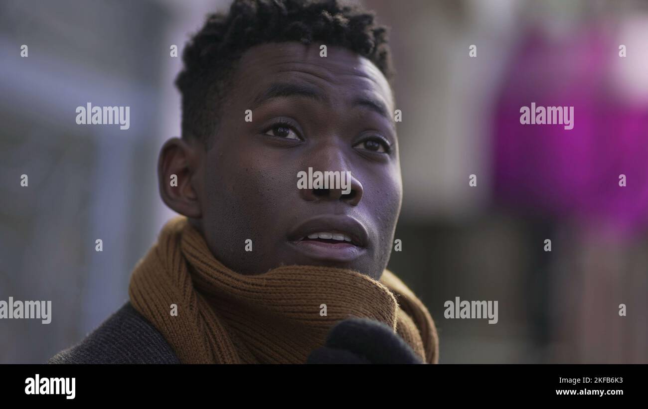 Contemplative African young man face looking up at the sky Stock Photo ...
