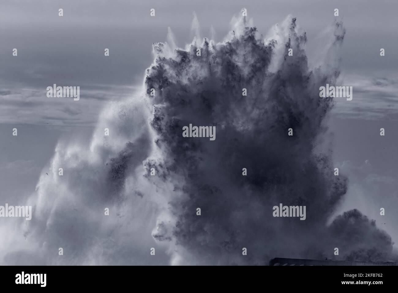 Huge stormy wave splash. Converted black and white. Toned blue Stock ...