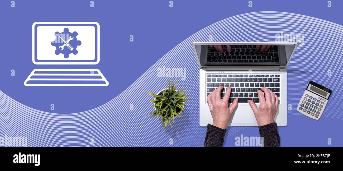Top view of hands using laptop with symbol of system maintenance ...