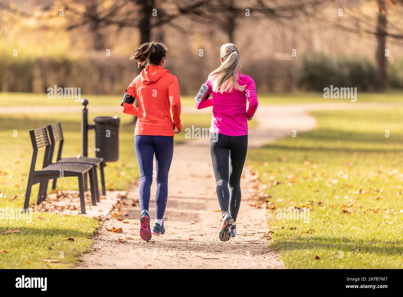 Back view two women running hi-res stock photography and images - Alamy