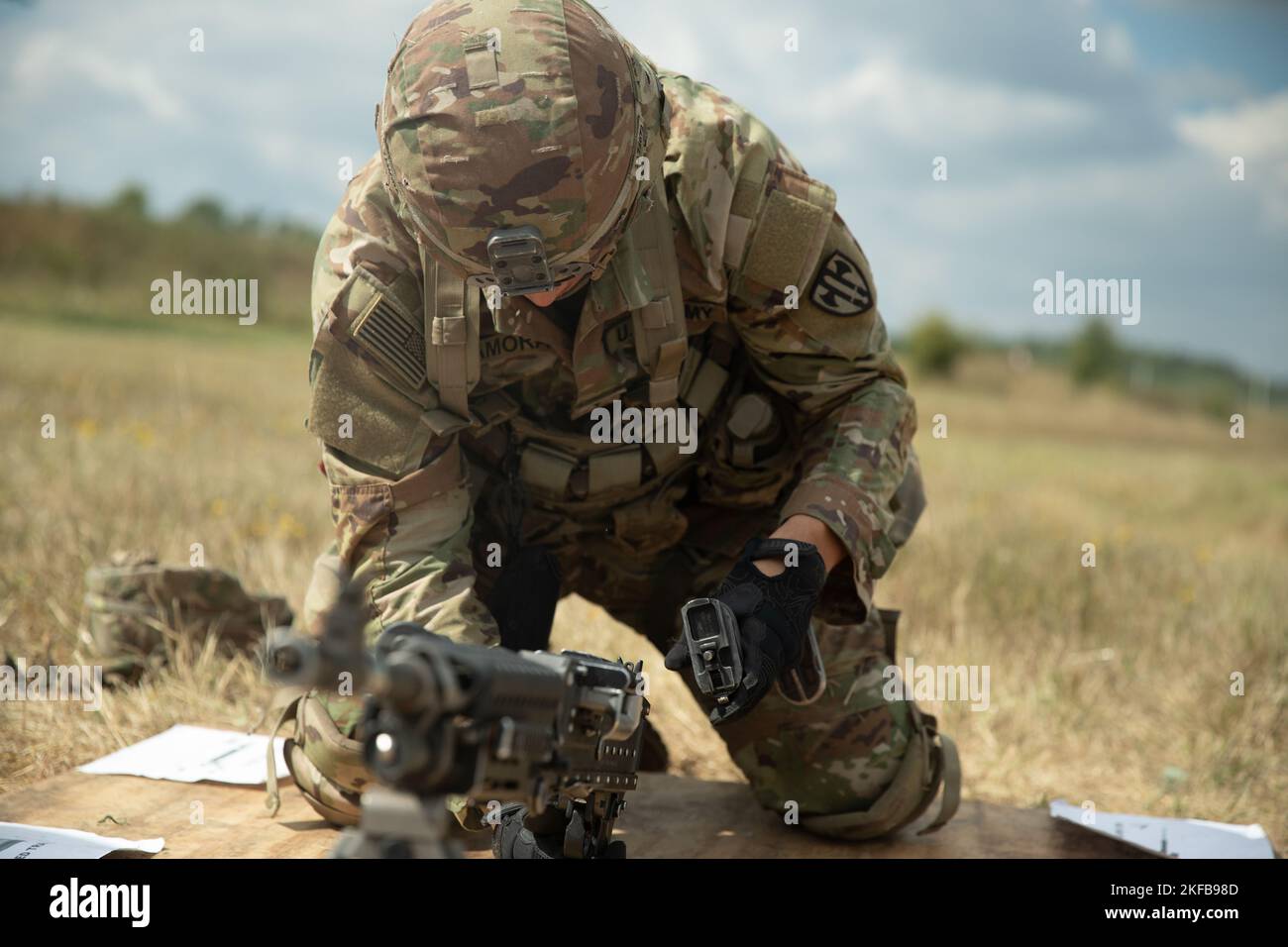 A U.S. Soldier disassemble a M249 during the weapons lane, to earn the ...