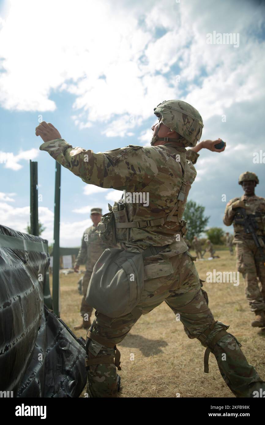 A U.S. Soldier throws the M67 grenade during the weapons lane, to earn ...