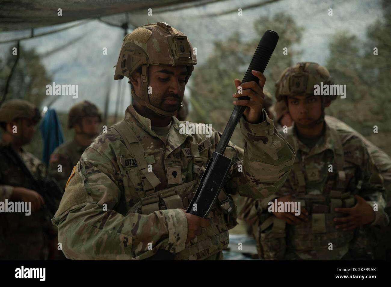 A U.S. Soldier assembles a Mossberg 590A1, during the weapons lane, to ...