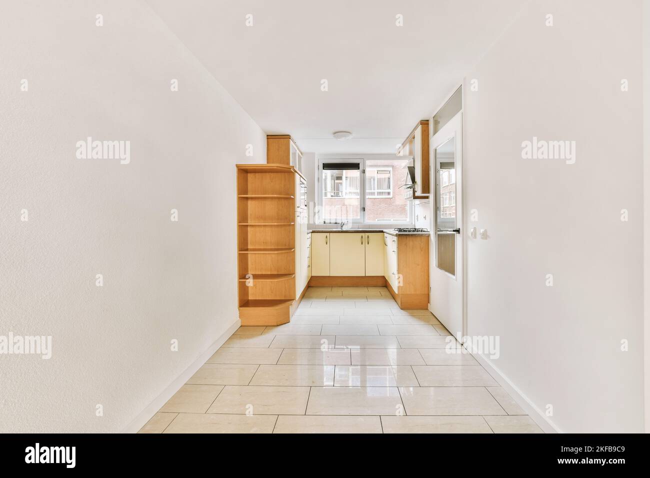 Interior of empty white kitchen with windows and wooden parquet floor ...