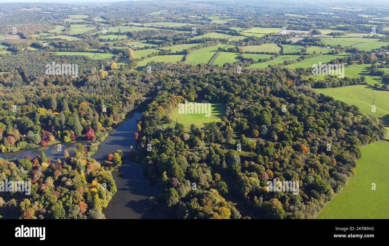 Sheffield Park in autumn sunshine showing vivid colours and lake Stock ...