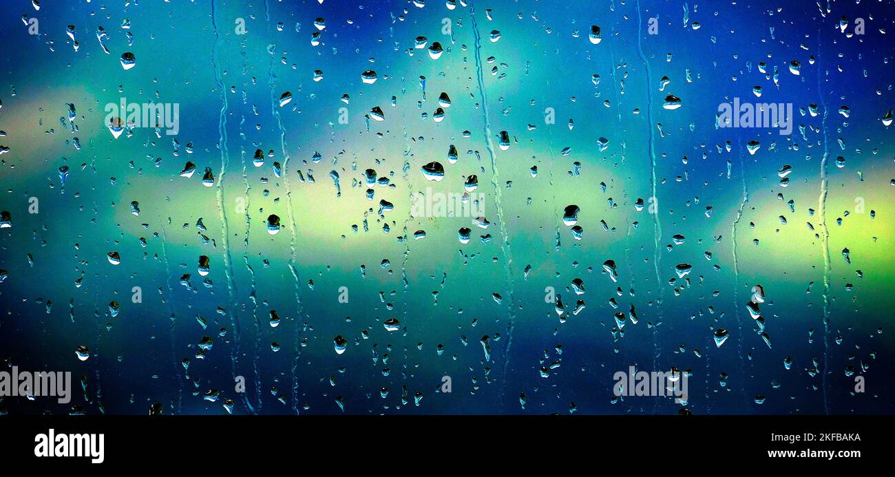 Rain drops drips water wet on window glass Stock Photo - Alamy