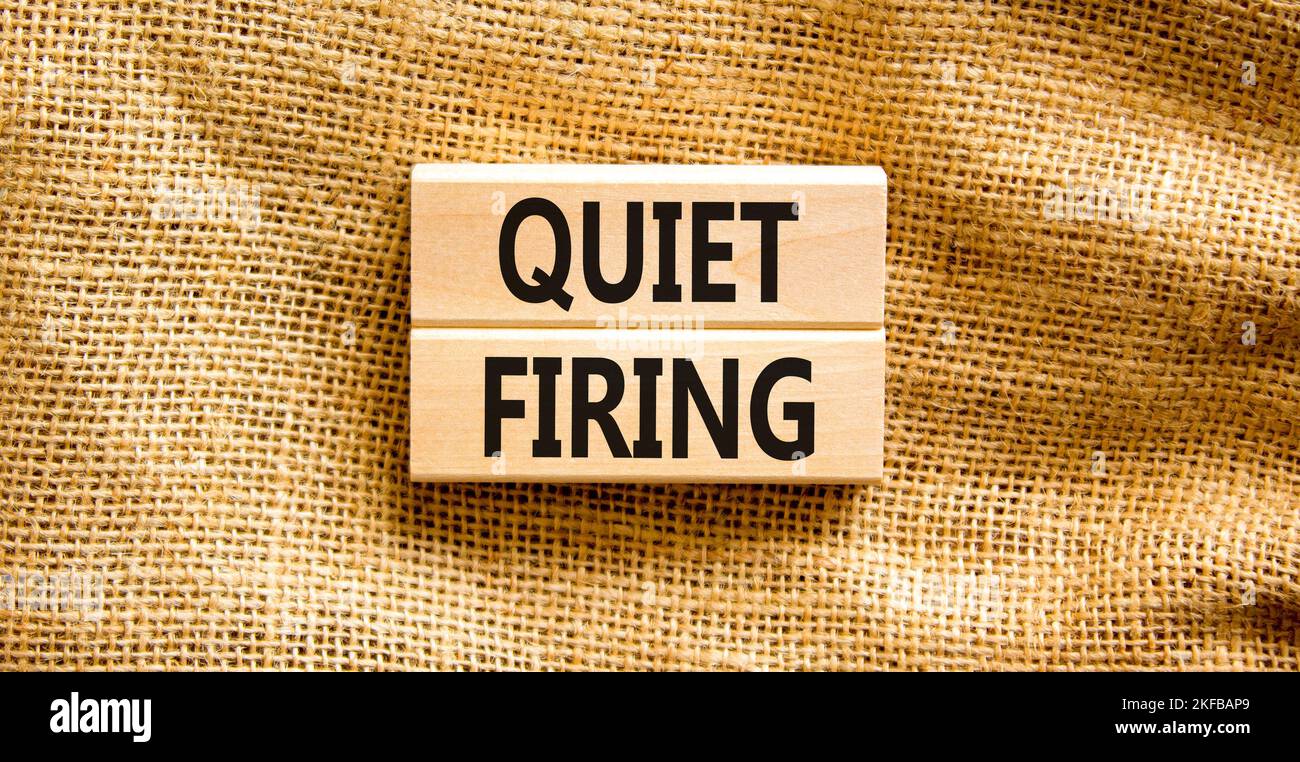 Quiet firing symbol. Concept words Quiet firing on wooden blocks ...