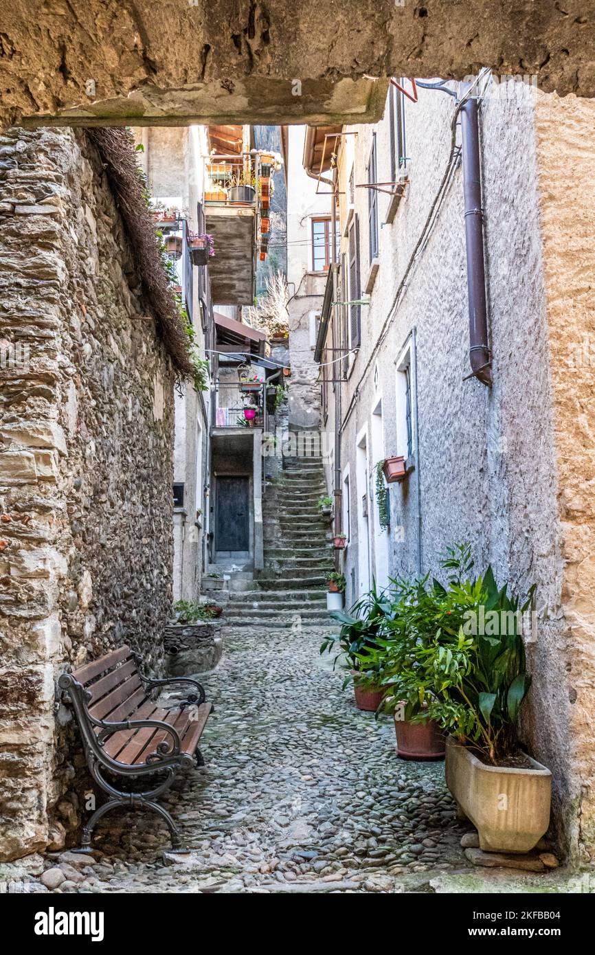 The interior of Corenno Plinio with narrow stone streets, arches and ...